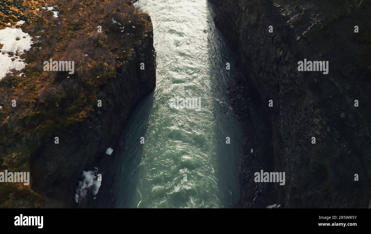 Aerial view of gullfoss waterfall river flowing between frozen canyon ...
