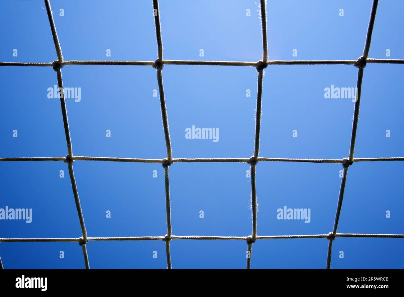 Sports net at football playground against blue sky Stock Photo - Alamy