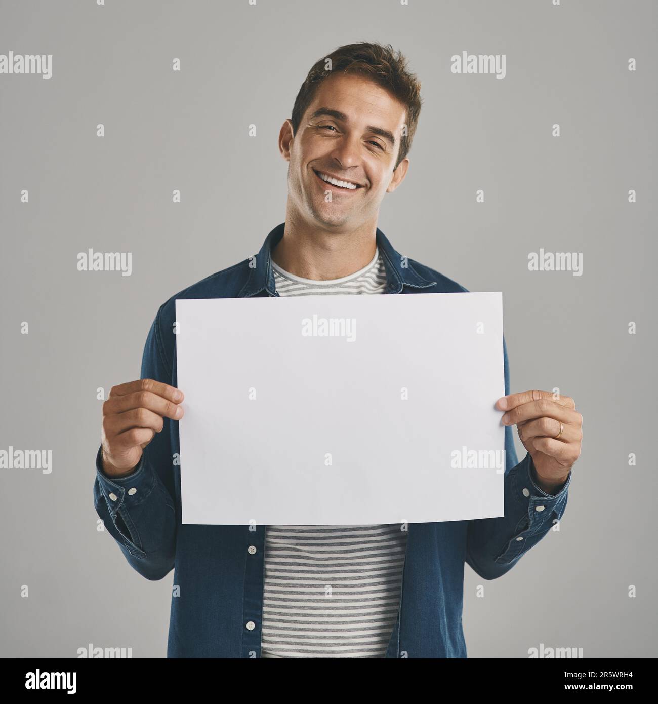 Its time to tell your story. Studio portrait of a young man holding a ...