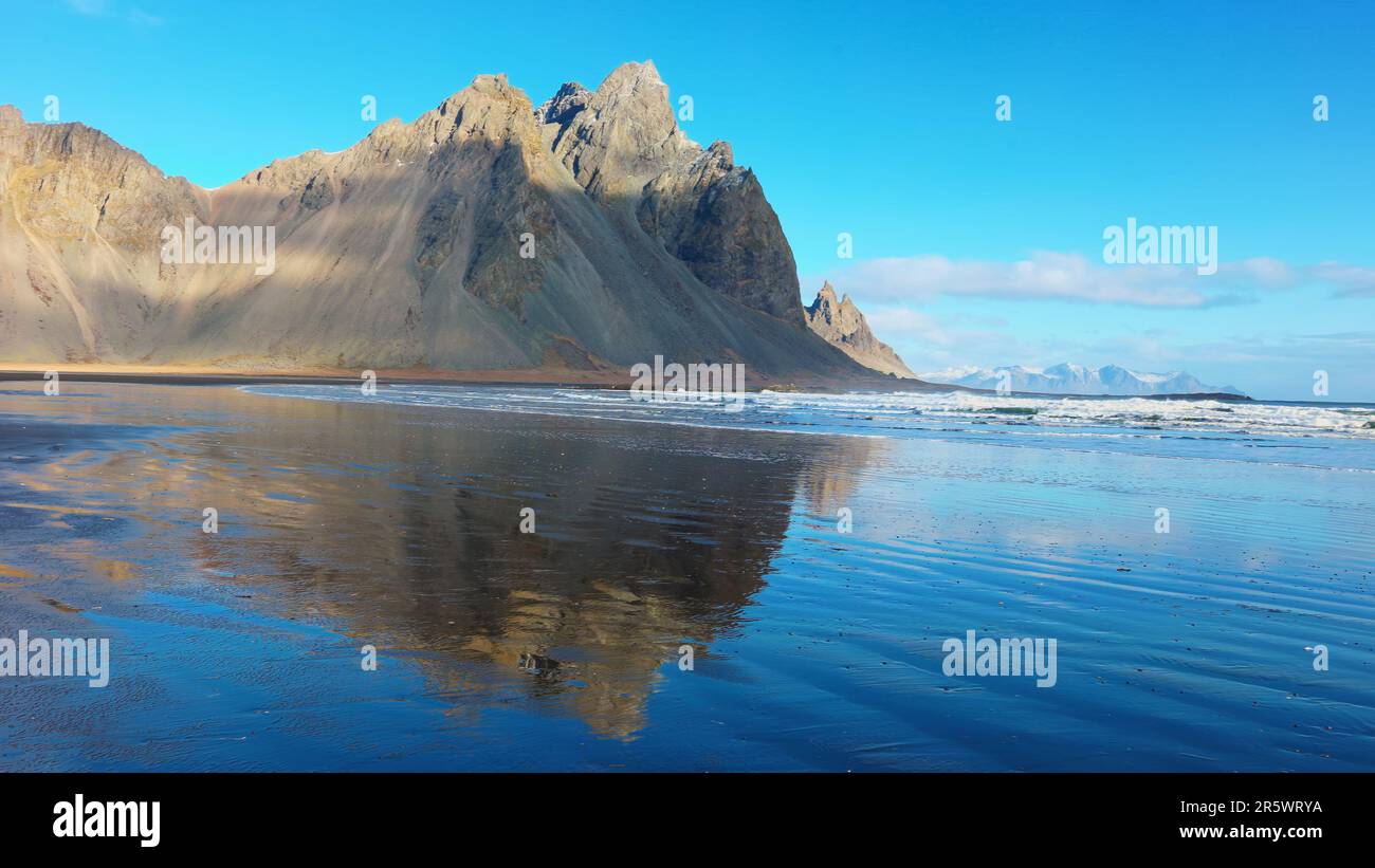 Massive mountain range meeting the ocean, beautiful icelandic ...