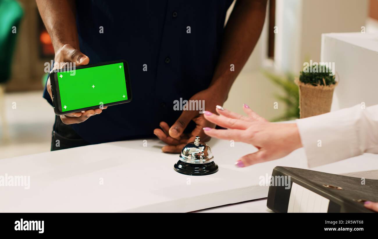 Client Holding Phone With Greenscreen Showing Mobile Phone Display With Isolated Chromakey To