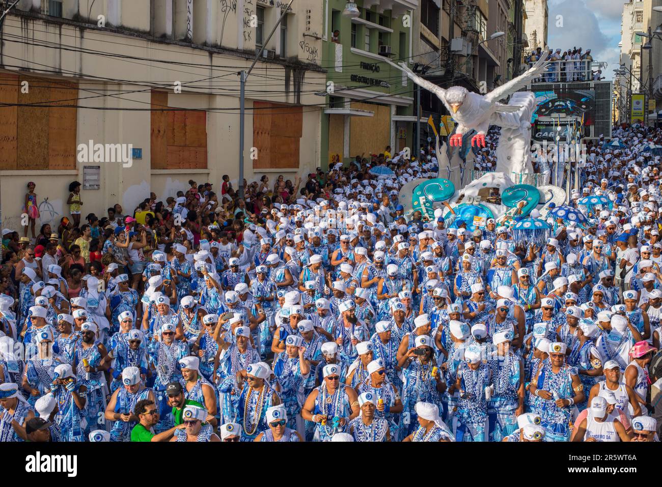 A diverse and vibrant group of people wearing colorful costumes ...
