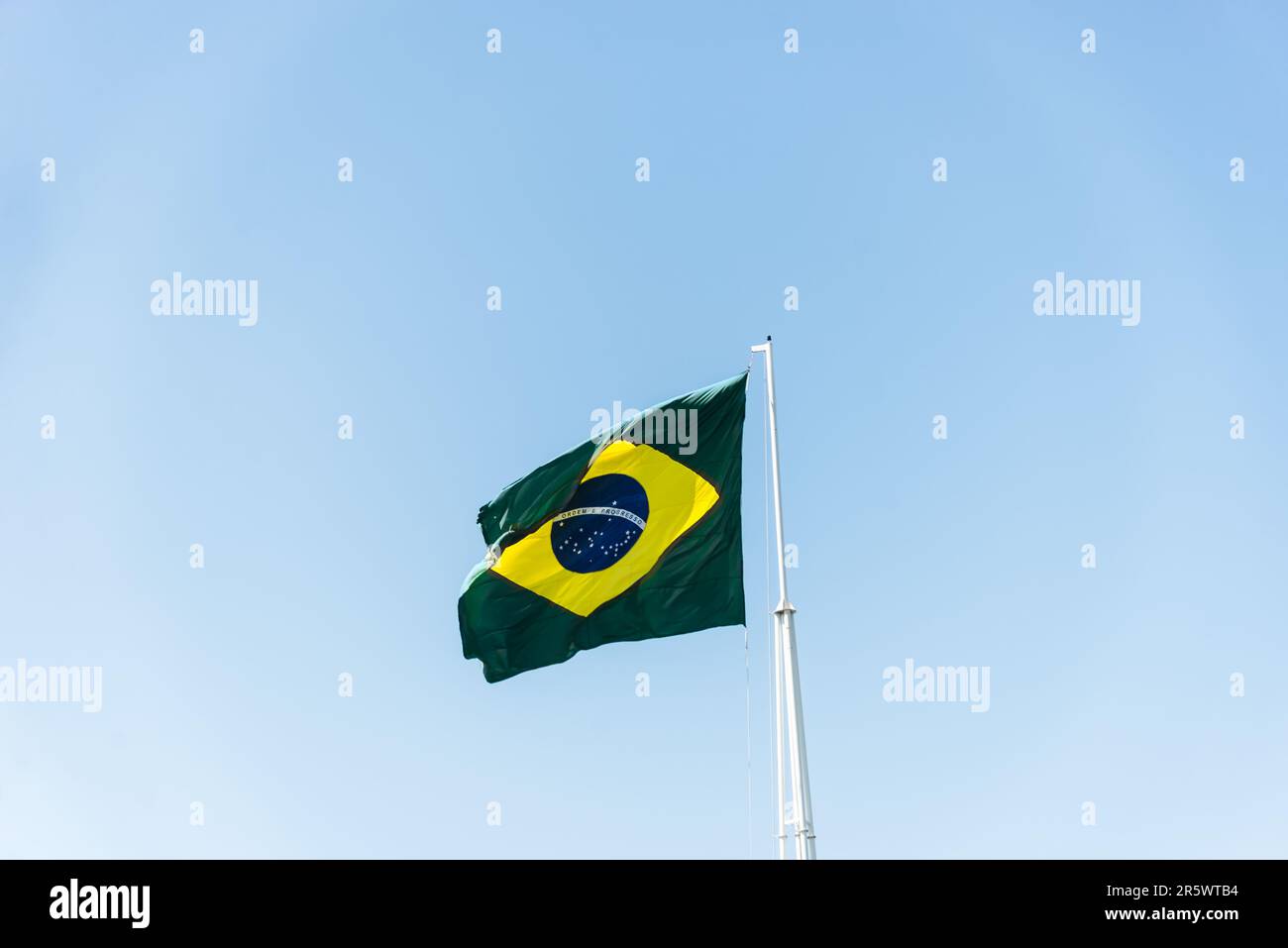 A high resolution image of the Brazilian flag proudly waving in a sunny ...