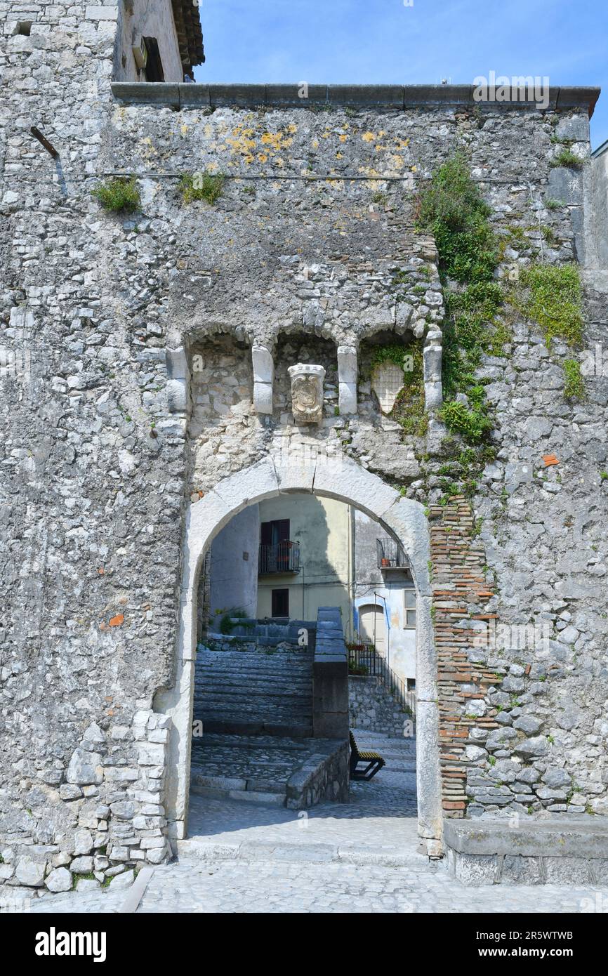 Ancient entrance arch in a small medieval village in the mountains of ...
