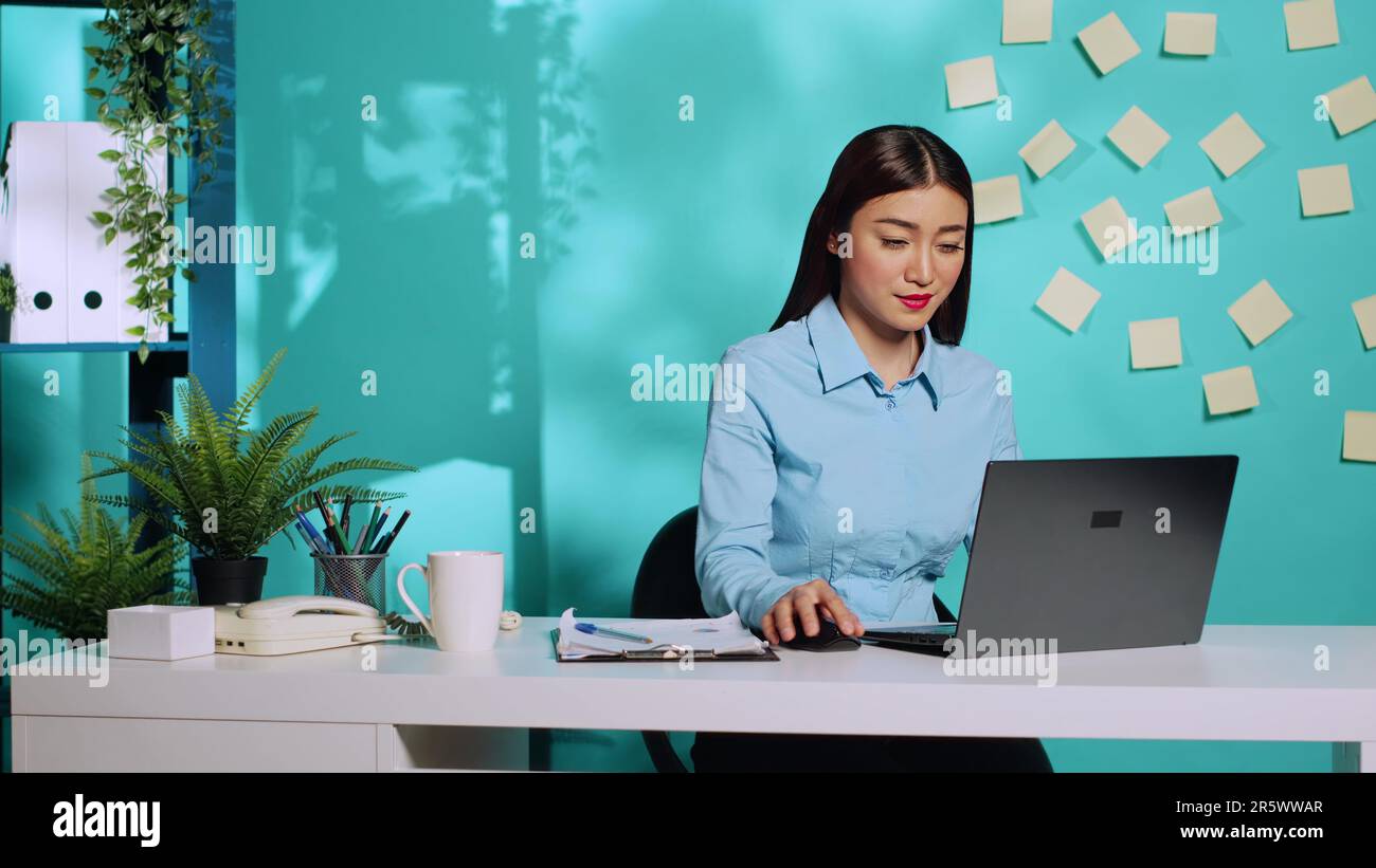 Office clerk cross checking paperwork hi-res stock photography and ...