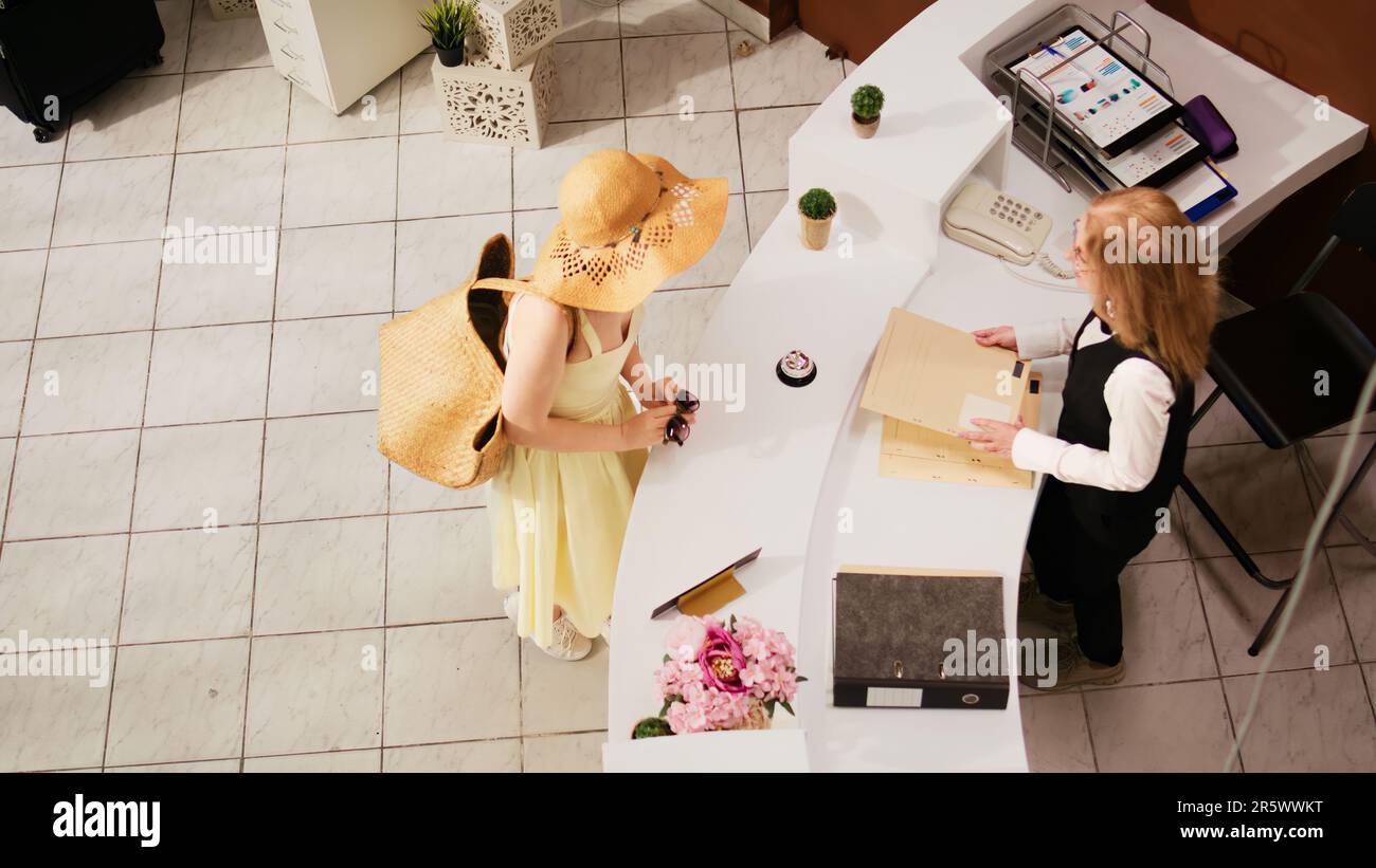 Hotel staff team greeting tourist hi-res stock photography and images ...