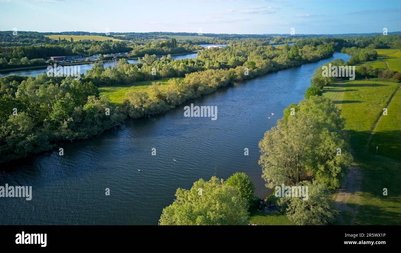 An aerial view along the Thames river by Thames Valley Park heading ...