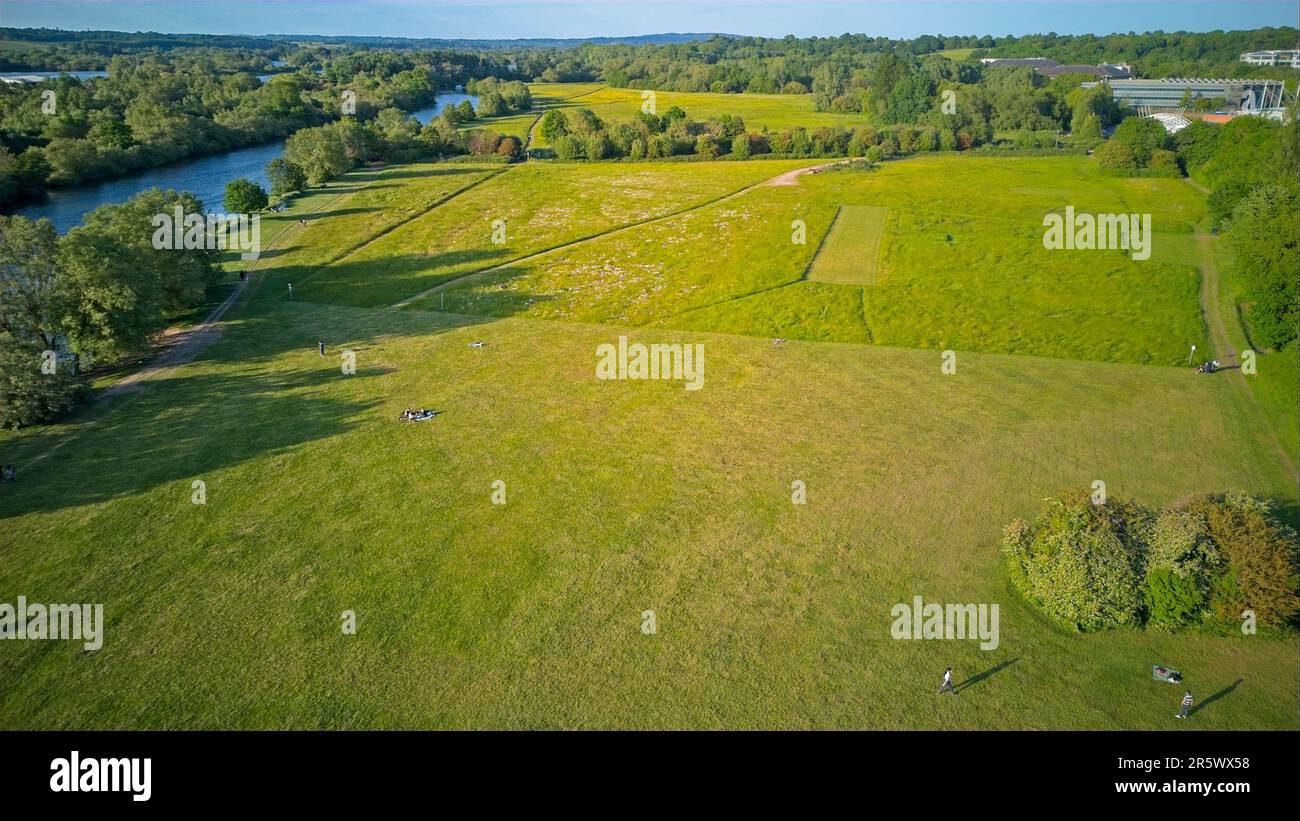 An aerial view along the Thames river by Thames Valley Park heading ...