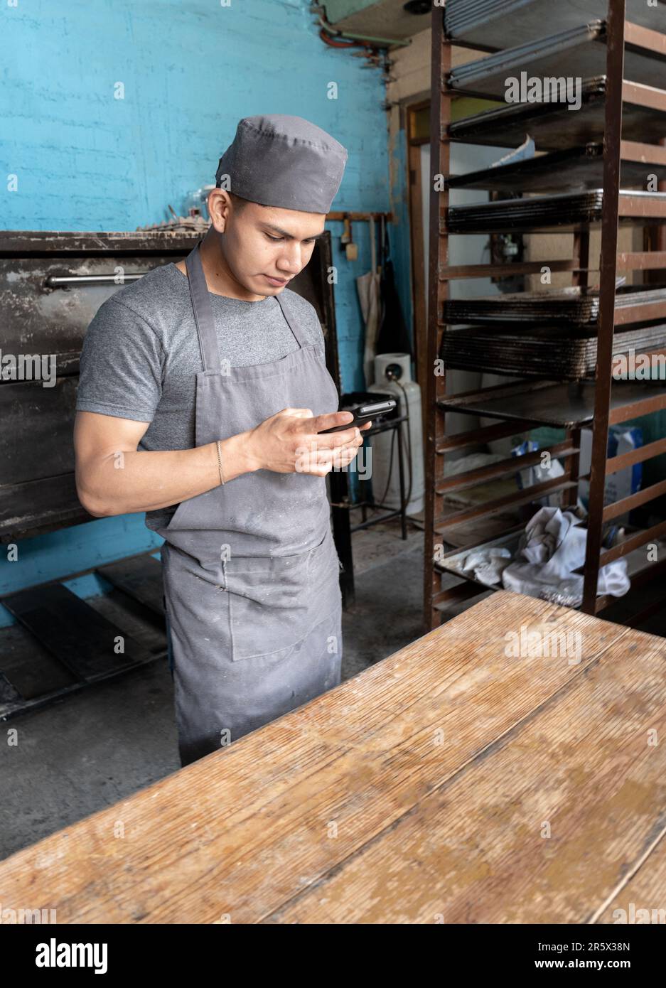 Hispanic man in bakery wearing hi-res stock photography and images - Alamy