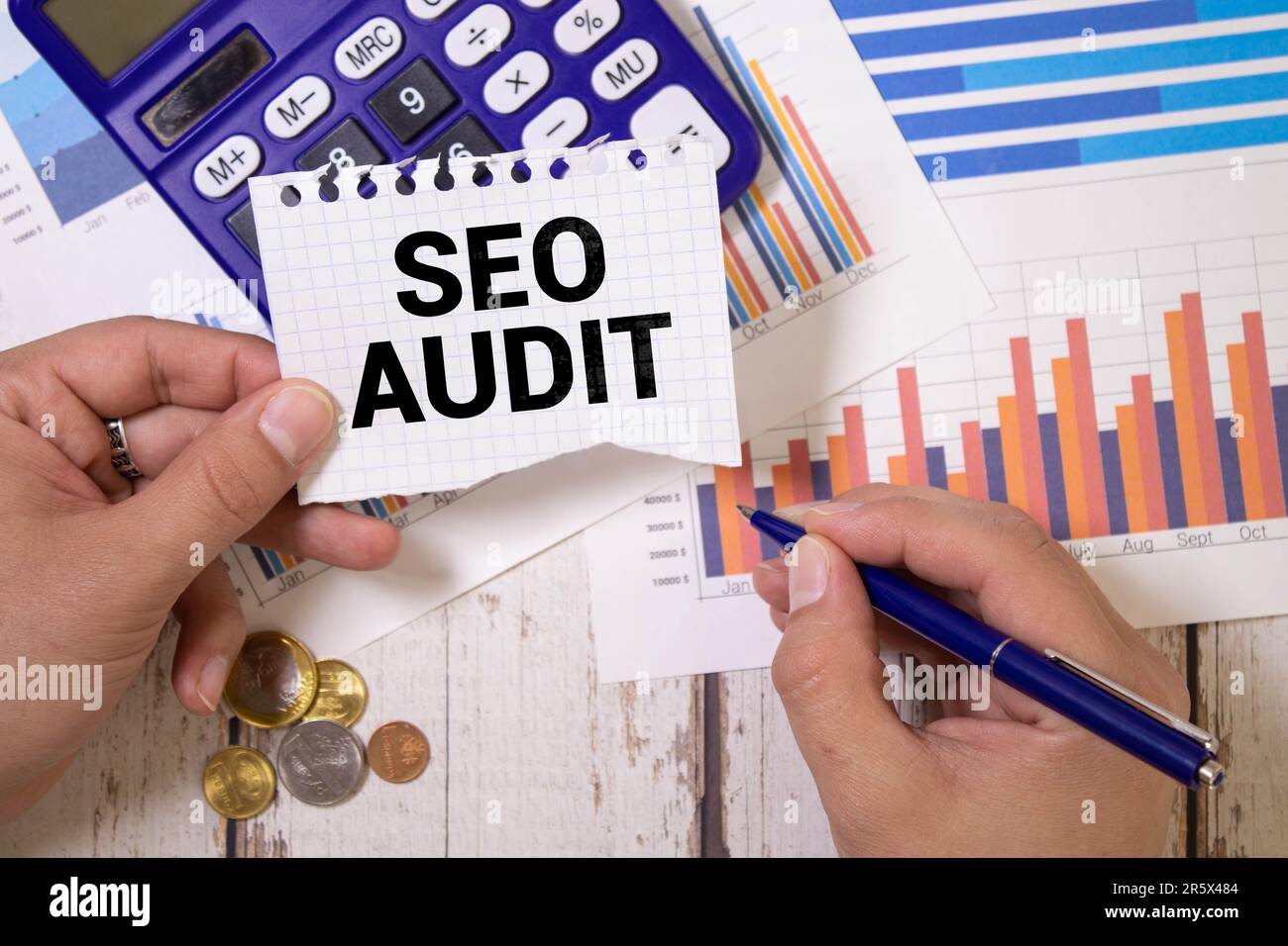 white paper with text Seo Audit on a yellow background with stationery ...