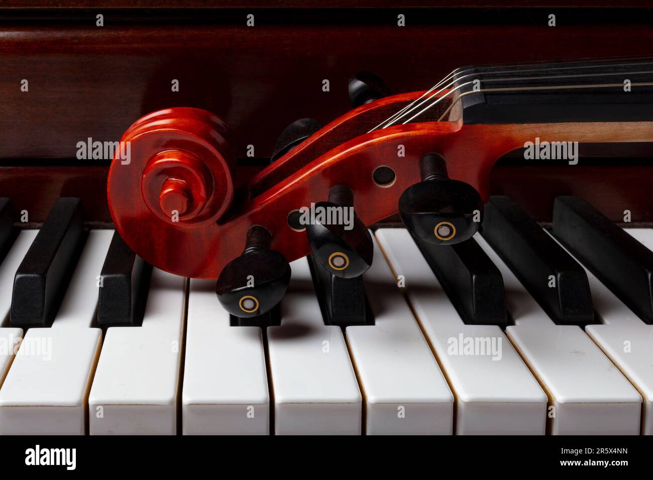 Violin Scroll On Piano Keys Still life Stock Photo - Alamy
