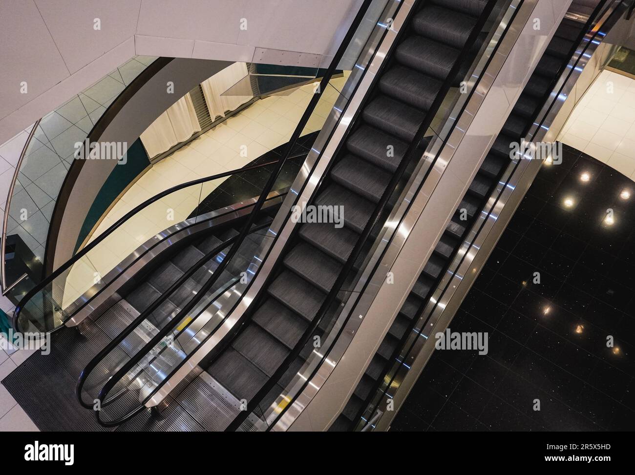 Spiral escalator shopping mall hi-res stock photography and images - Alamy