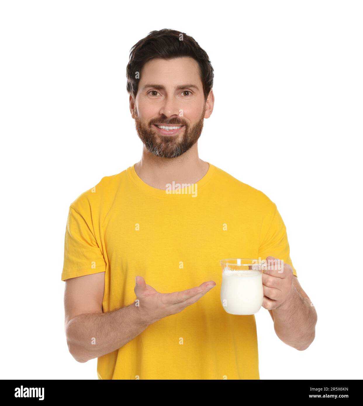 Handsome man with delicious yogurt on white background Stock Photo - Alamy