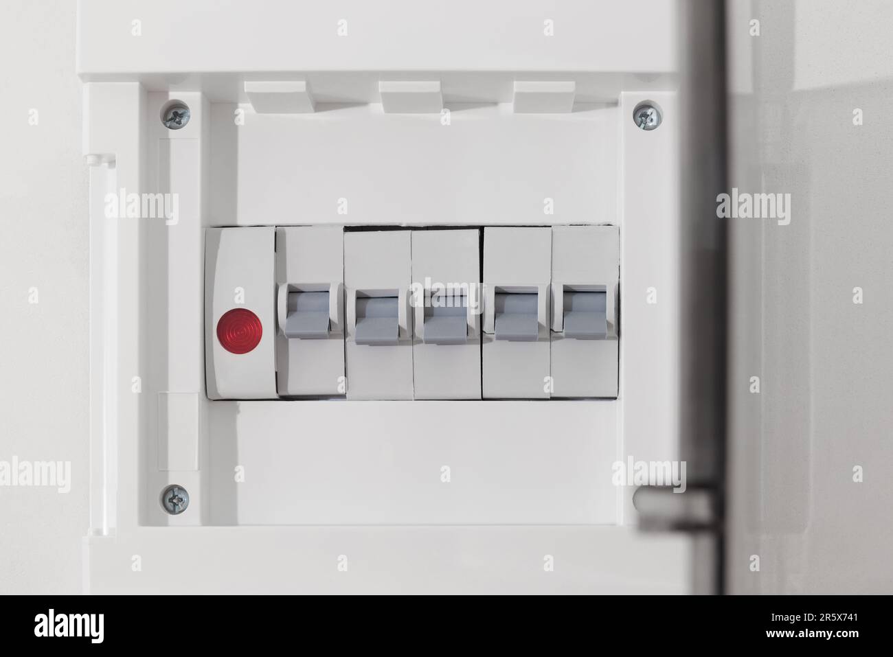 Open fuse box on beige wall, closeup Stock Photo - Alamy