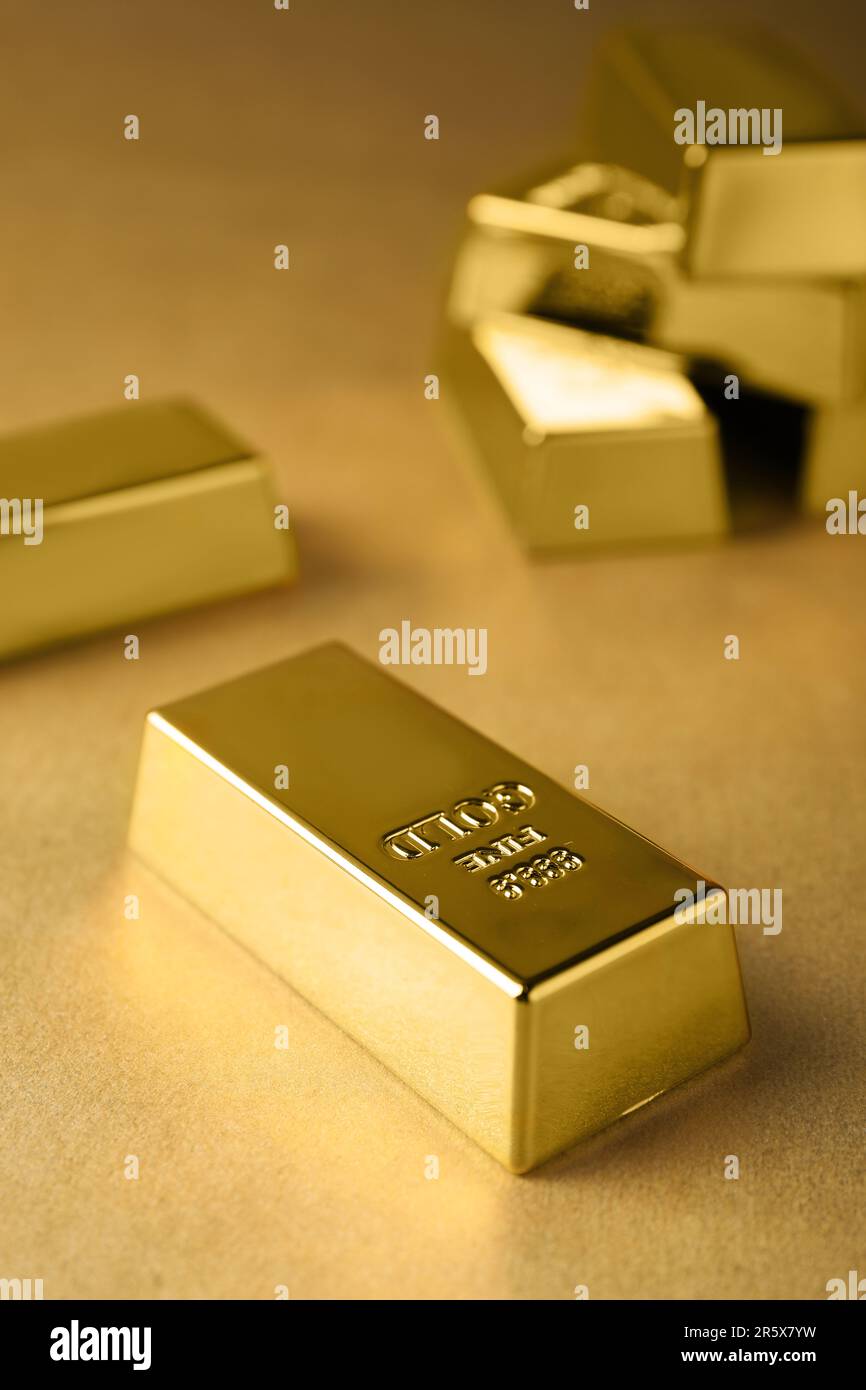 Many shiny gold bars on color background Stock Photo - Alamy