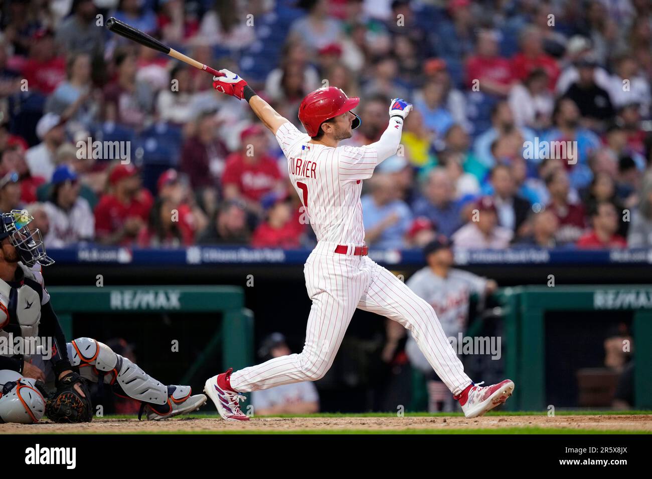 Philadelphia Phillies' Trea Turner follows through after hitting a home ...