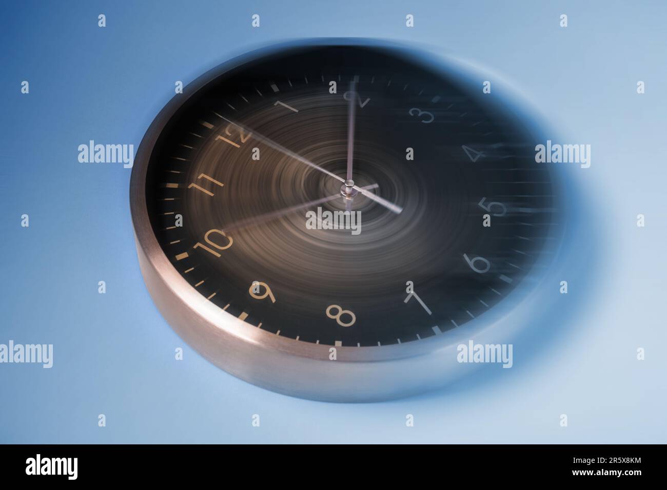 Fleeting time concept. Clock on light blue background, motion effect ...