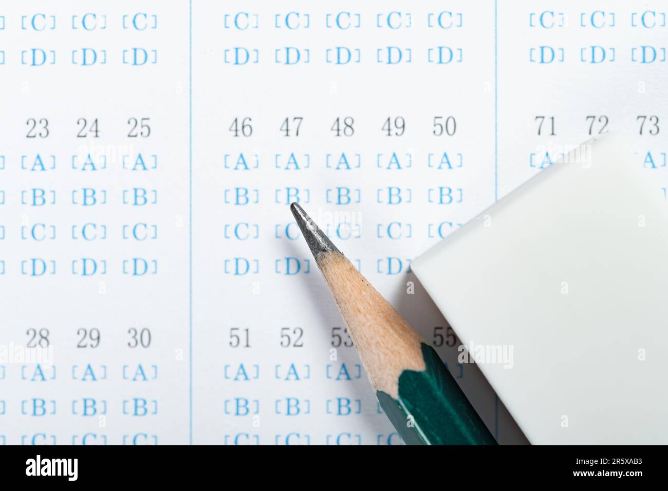 top view test score sheet and pencil and eraser close up horizontal ...
