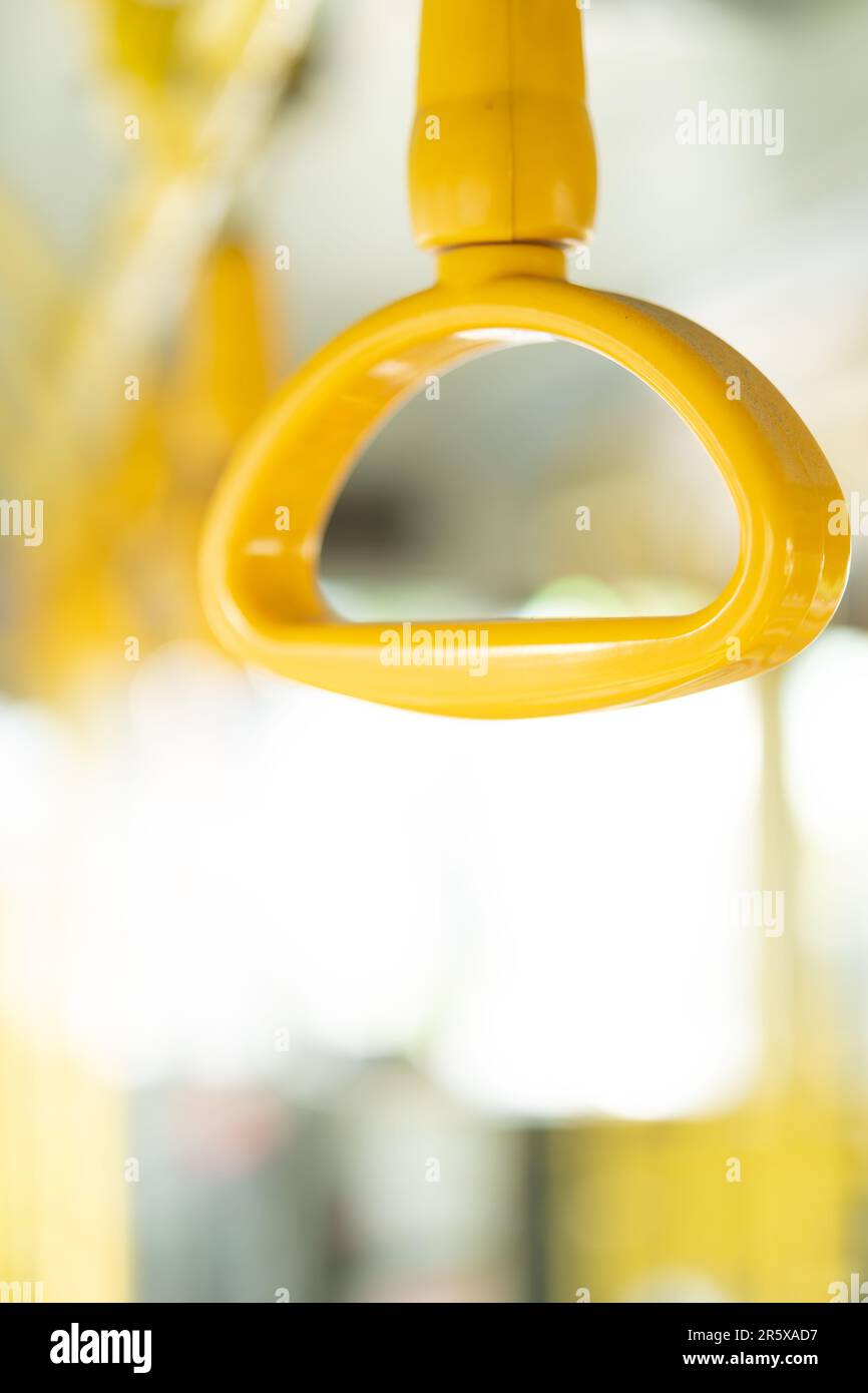 handgrip inside a bus vertical composition Stock Photo - Alamy