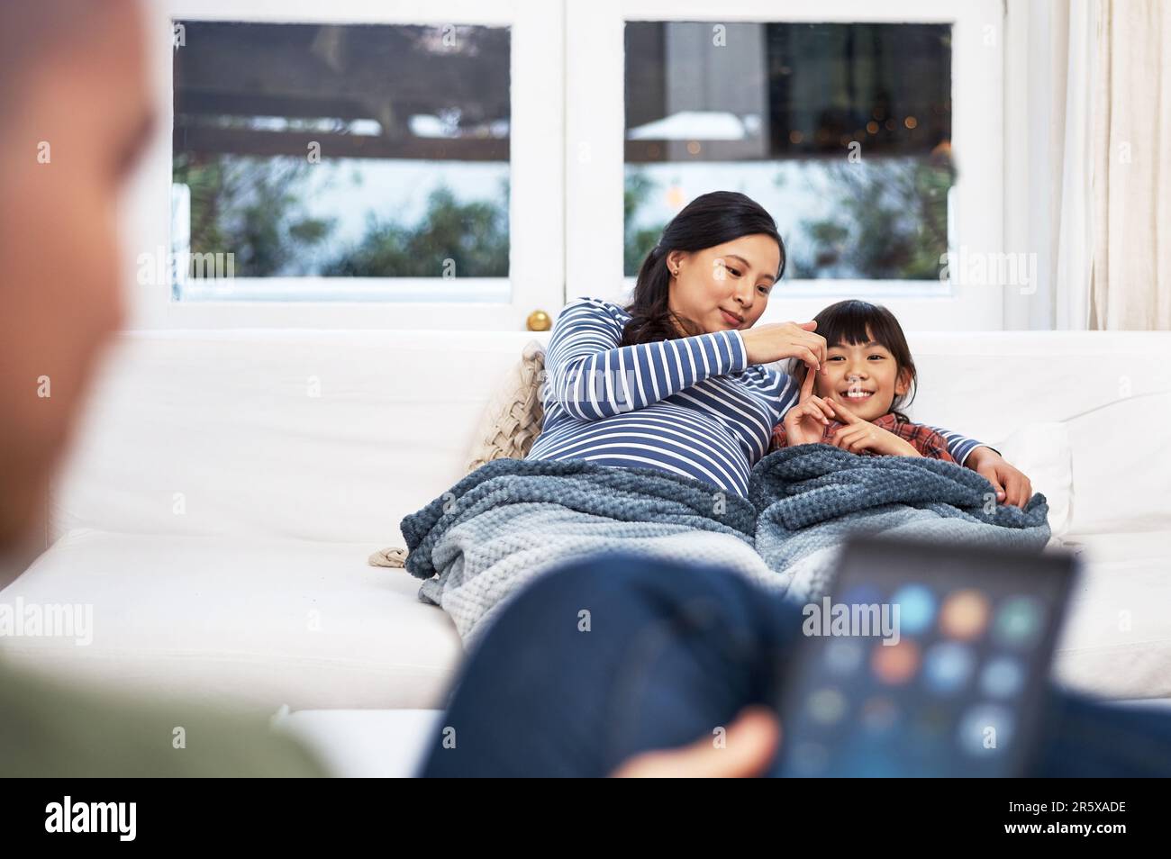 Happiness fills this home. a family bonding together at home Stock ...