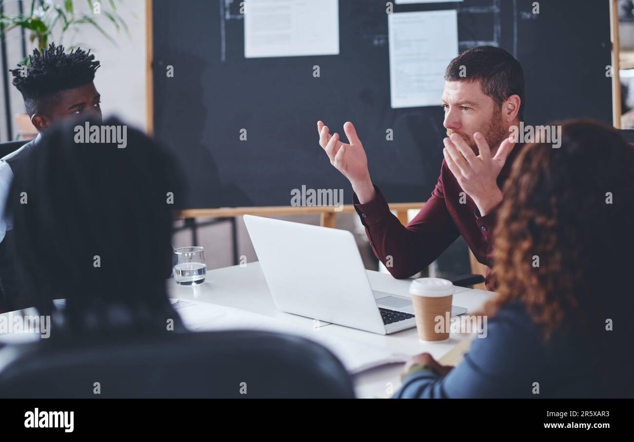 Im open to suggestions. a group of creative businesspeople meeting in ...