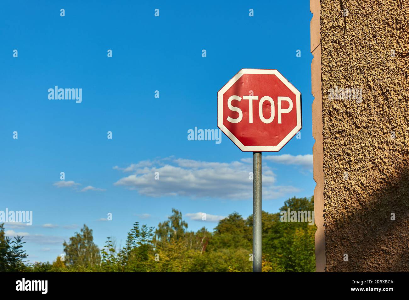Stop sign on a corner Stock Photo - Alamy