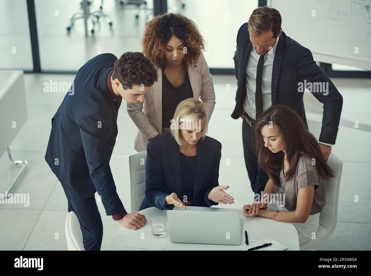 Staying on topic with focus and teamwork. a group of colleagues using ...