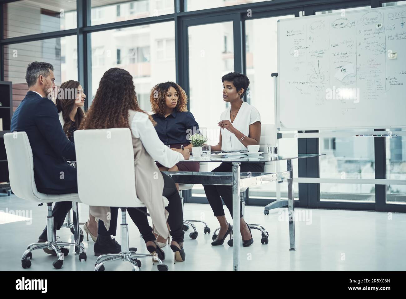 Staying aligned on business objectives. a group of colleagues having a ...