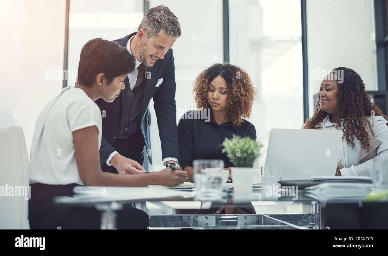 Decision making done as one. a group of colleagues having a meeting in ...
