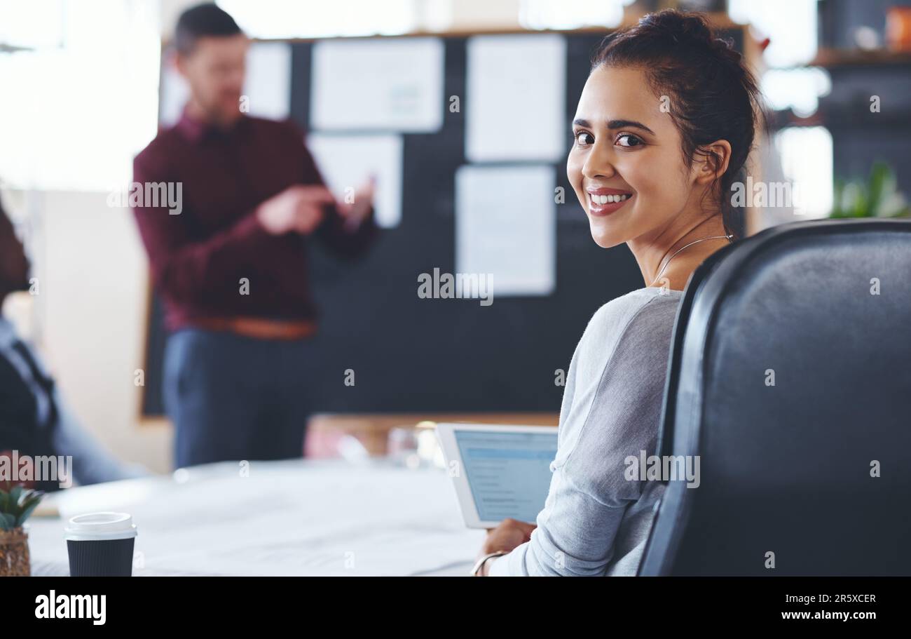 The meeting is so informative. Portrait of a young businesswoman using ...