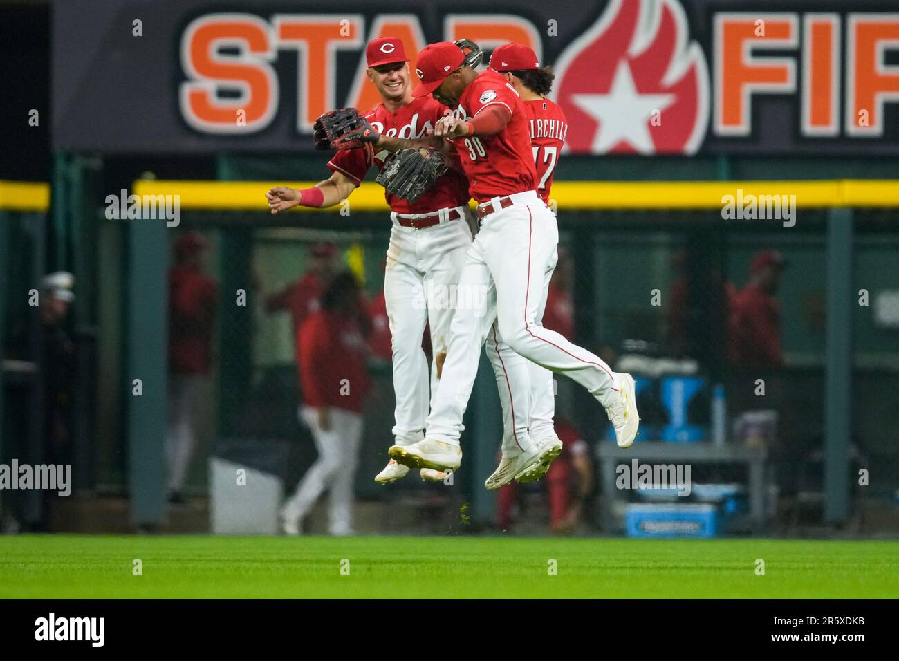 Cincinnati Reds' TJ Hopkins, left, Stuart Fairchild, right, and Will ...