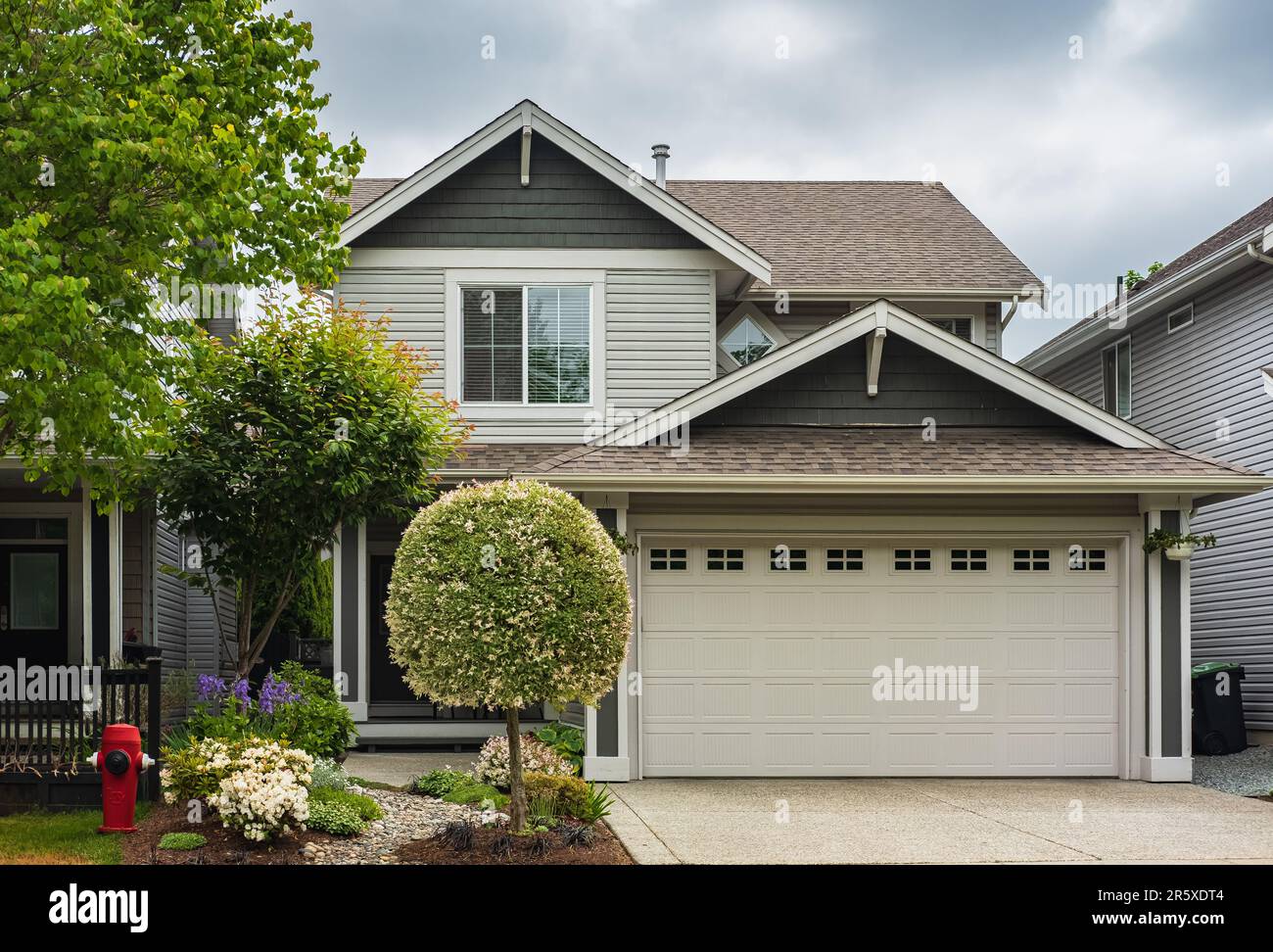 Real Estate Exterior Front House on a sunny day. Big custom made luxury ...