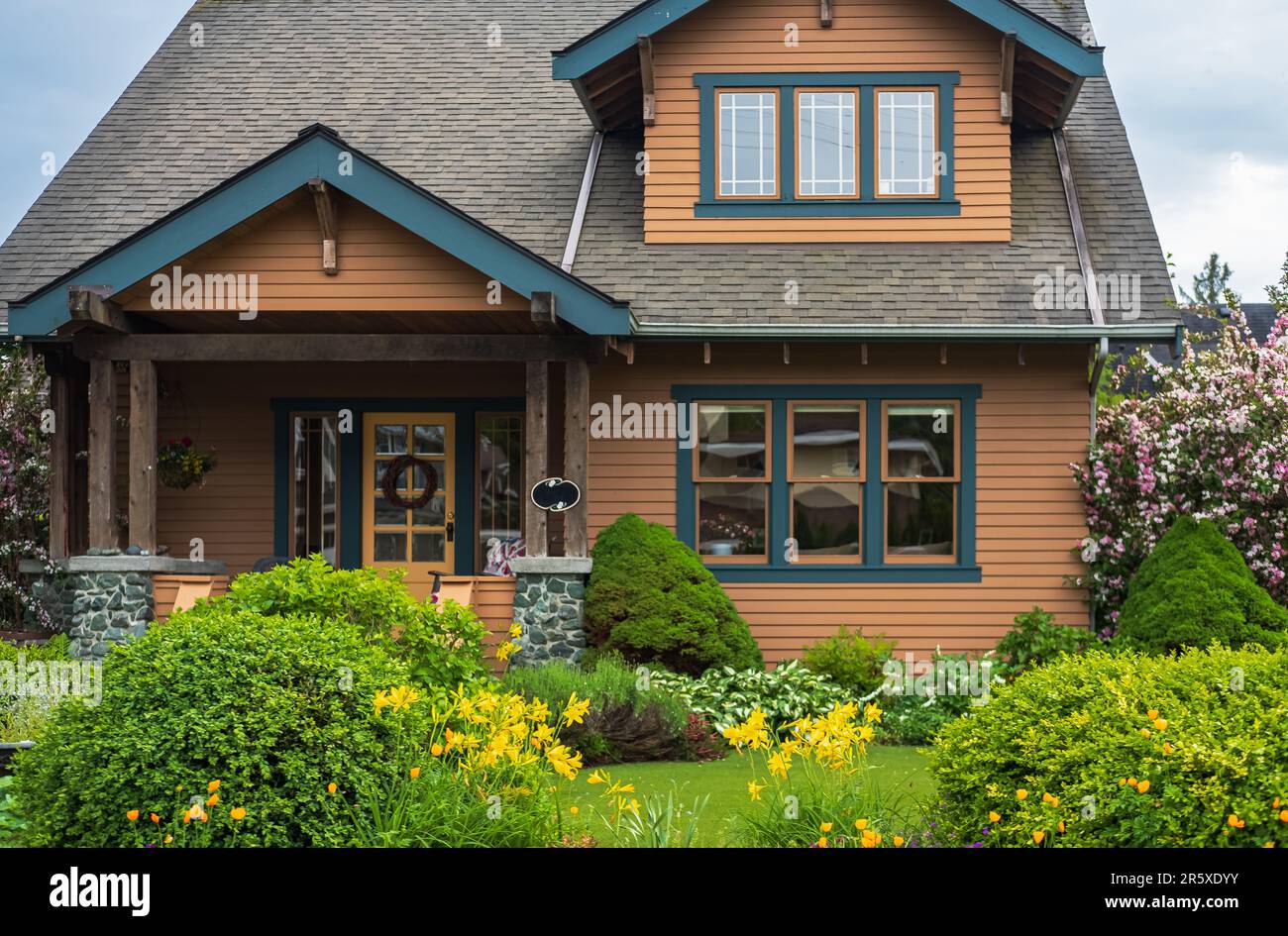 Real Estate Exterior Front House on a sunny day. Big custom made luxury ...