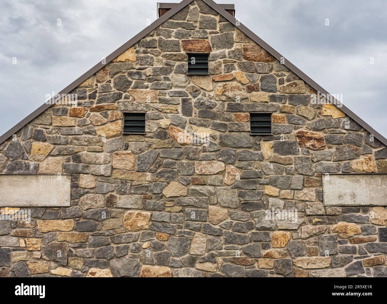View of a Traditional Old Stone House in a rural Countryside. Top of ...