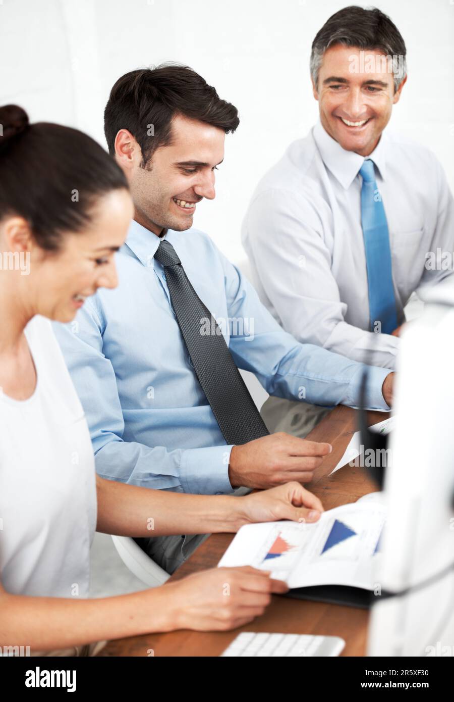 Working together well - Teamwork. Businesspeople working together at a ...