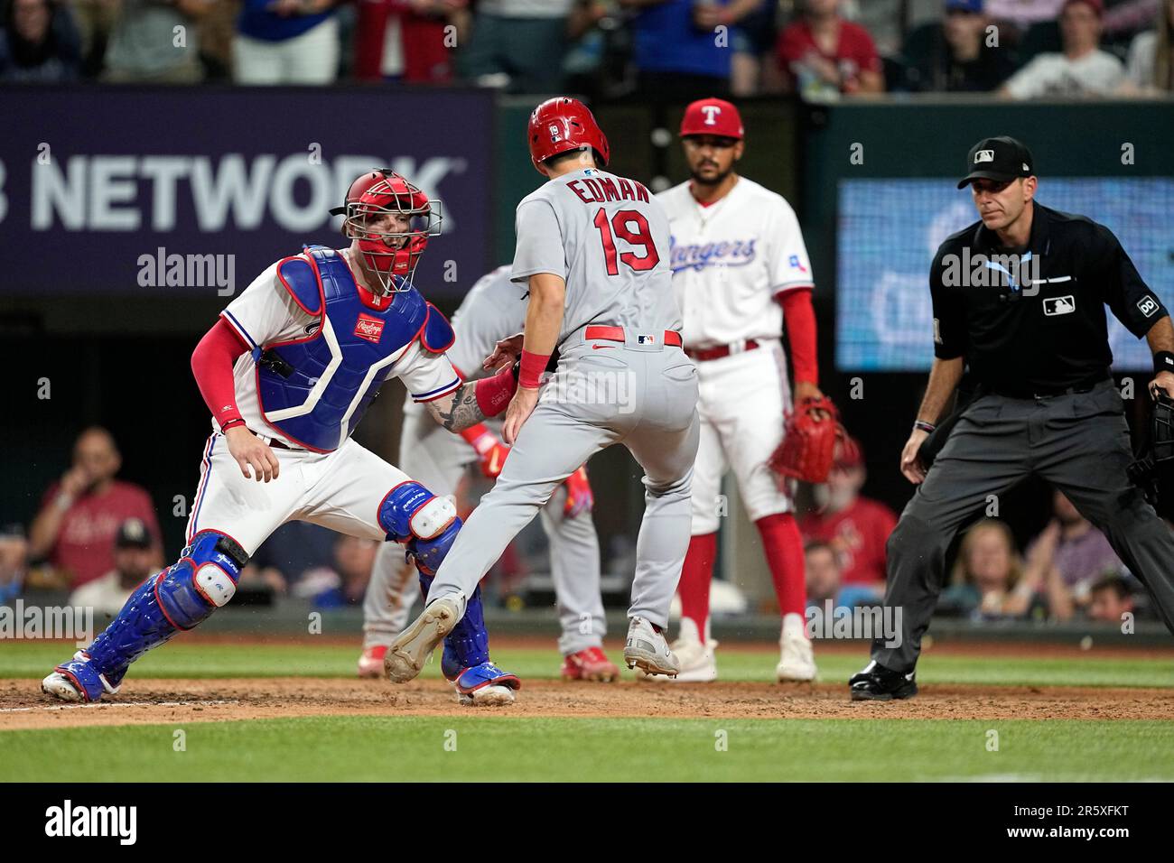 Texas Rangers catcher Jonah Heim, left, tags out St. Louis Cardinals ...