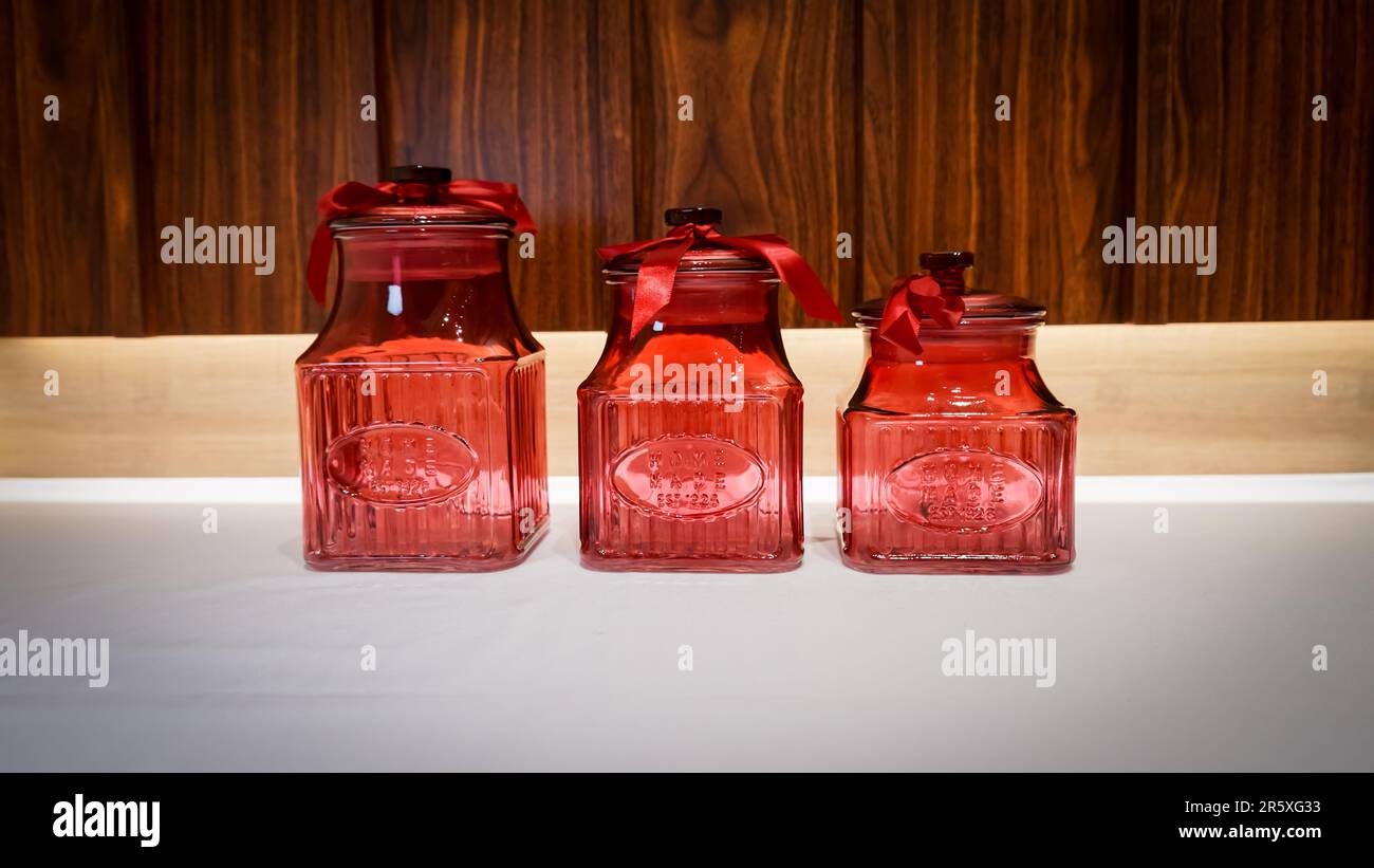 A Red Ribbon Adorned Jar is a beautifully crafted jar that has been ...