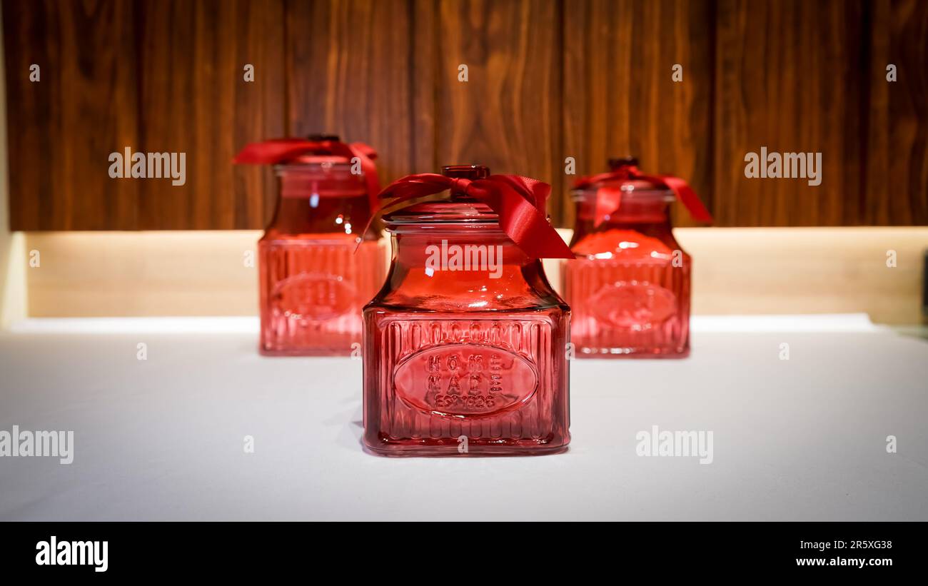 A Red Ribbon Adorned Jar is a beautifully crafted jar that has been ...