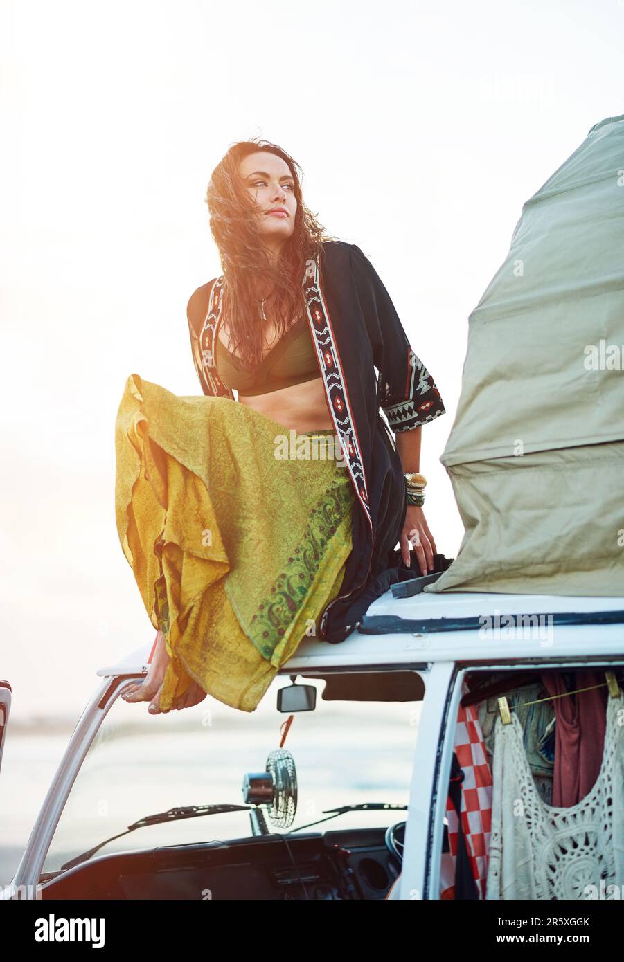 Get lost in nature. a young woman stopping at the beach during a ...