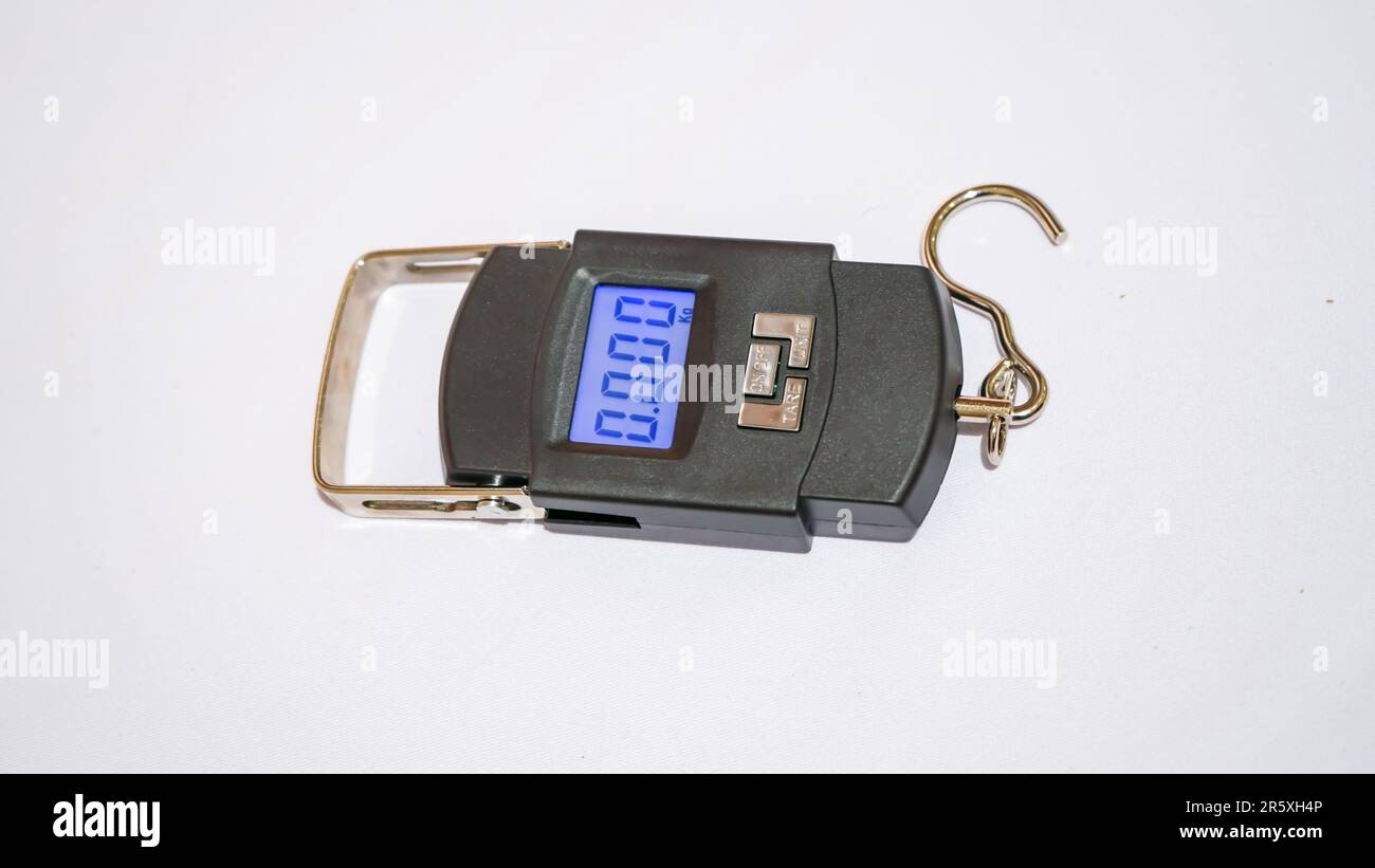 A black digital hanging scale is a portable and convenient device used for weighing various ...
