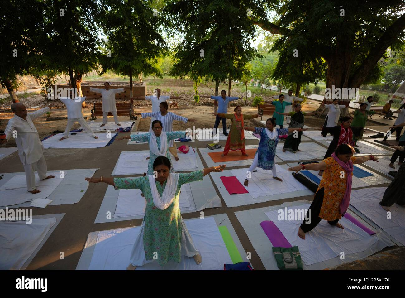 People perform yoga in a group at the Khusro Bagh garden and burial ...