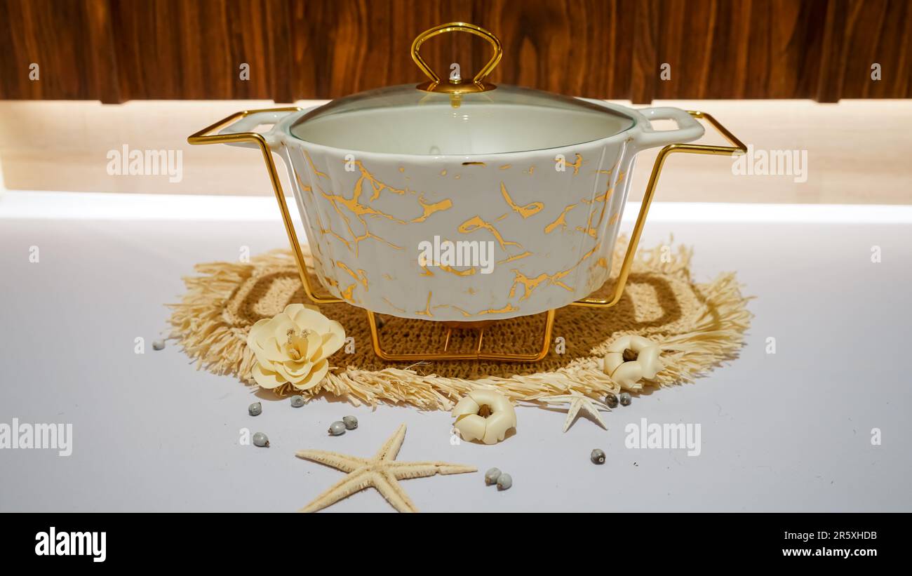 The White Ceramic Buffet Pot is a stylish and functional solution for ...