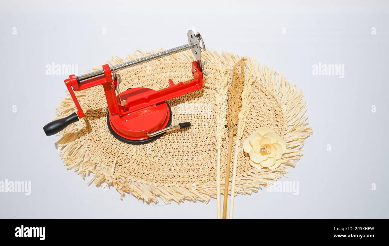 Red Spiral Potato Slicer is a kitchen tool designed to create spiral ...