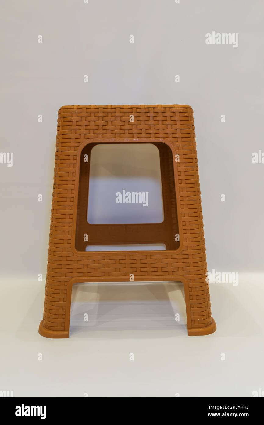 The Brown Woven Pattern Plastic Chair is a stylish and practical ...