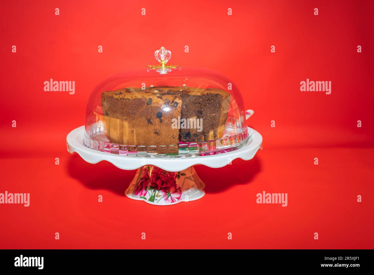 The White Ceramic Round Cake Stand with Flower Motif is a stunning ...