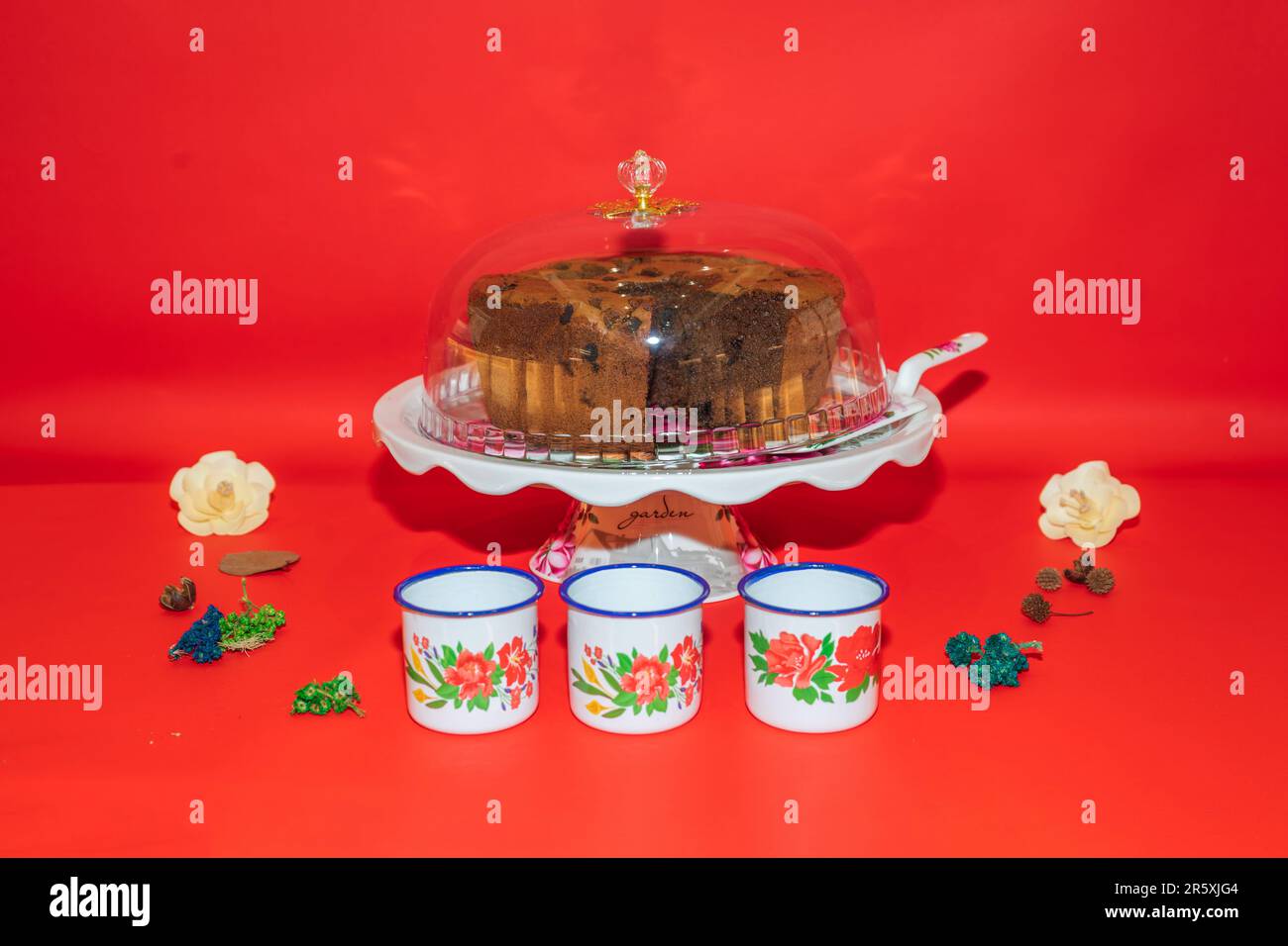 The White Ceramic Round Cake Stand with Flower Motif is a stunning ...