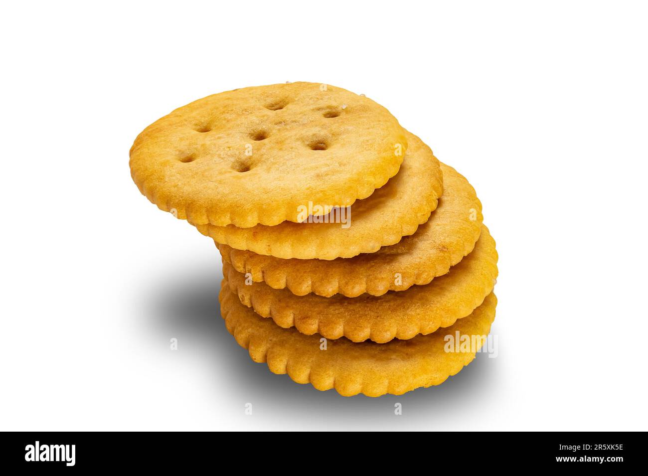 High angle view stack of crunchy salted round crackers isolated on ...