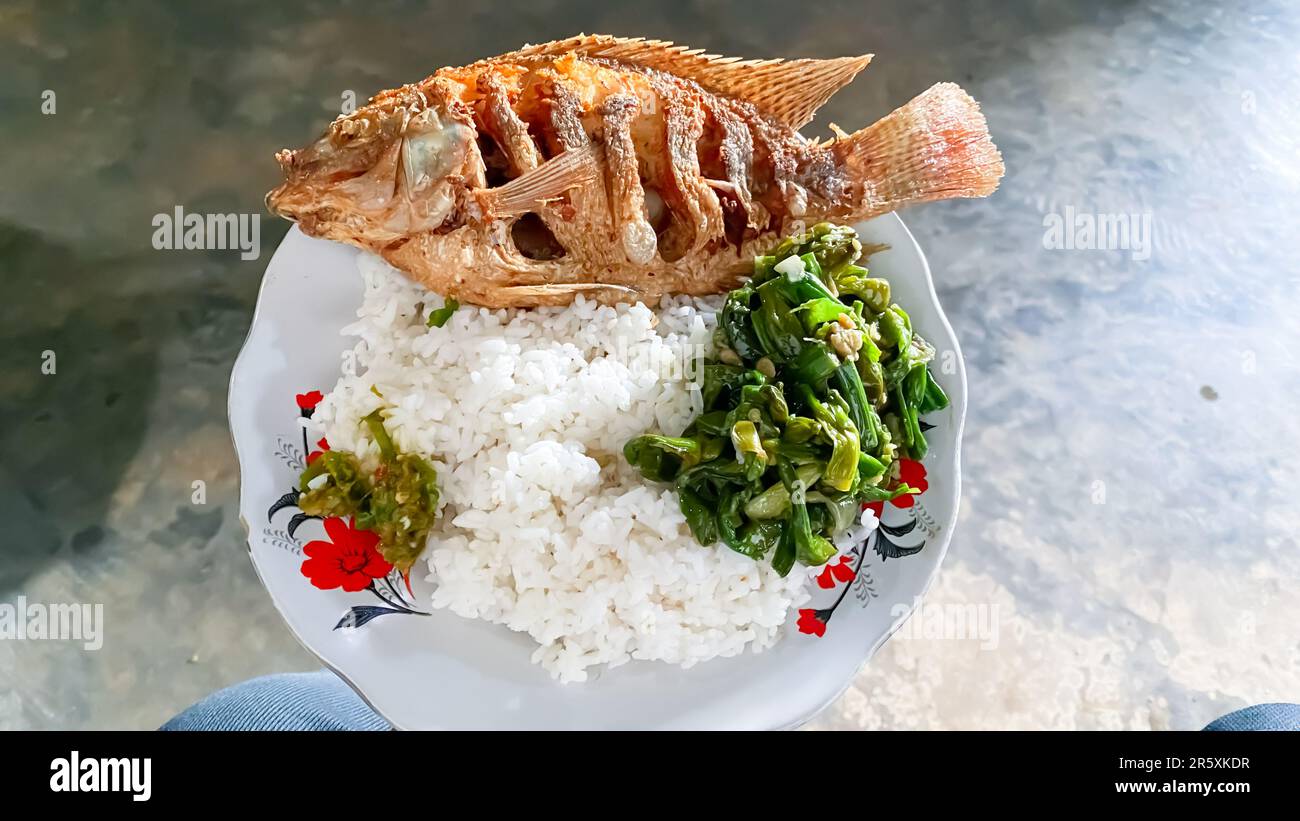 . The steamed white rice provides a neutral base that complements the ...