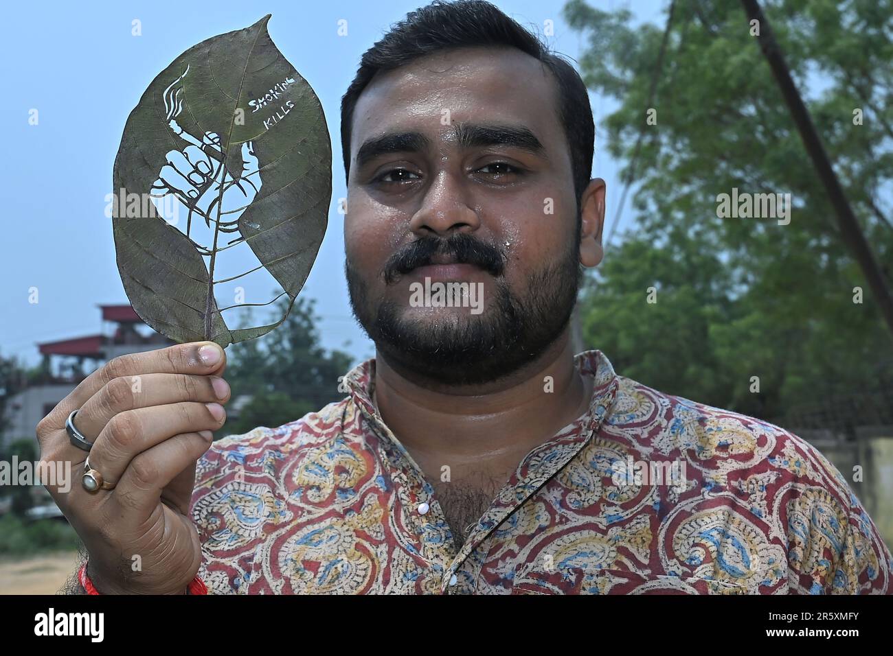 Leaf artist Subham Saha shows his creation depicting the theme of ...