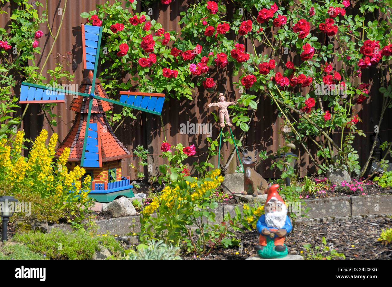 Garden House with Climbing Roses Stock Photo - Alamy